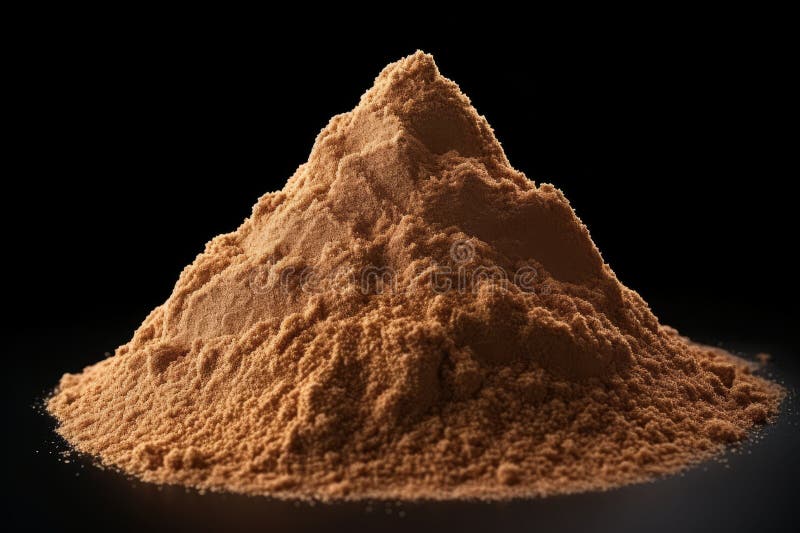 Brown Powdered Substance Piled on a Dark Background with a Clear Focus ...