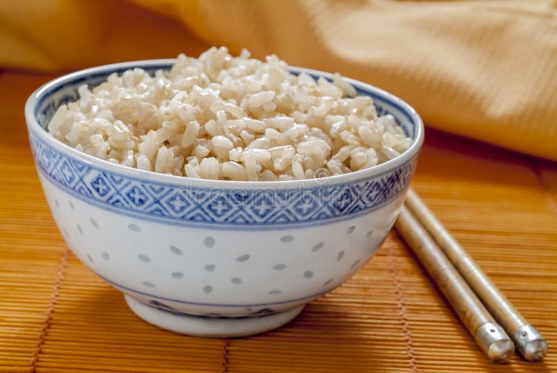Brown Rice in Blue and White Rice Pattern Bowl Stock Photo - Image of ...