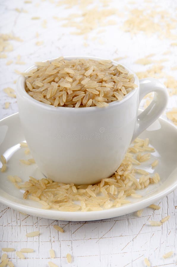 Brown rice in a cup stock image. Image of uncooked, rice - 39114579