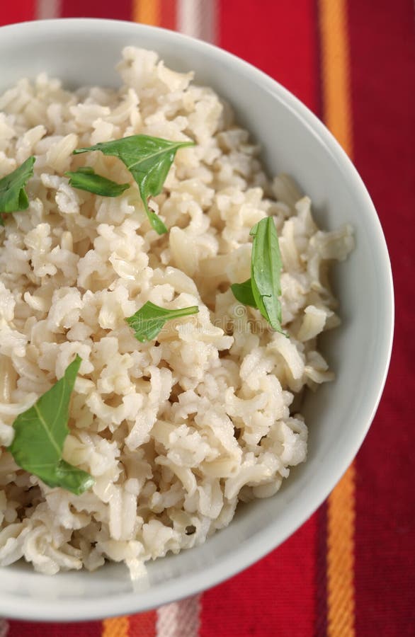Brown rice with garnish stock image. Image of cloth, basil - 6670813
