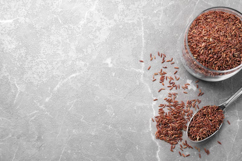 Brown Rice on Grey Marble Table, Flat Lay. Space for Text Stock Photo ...