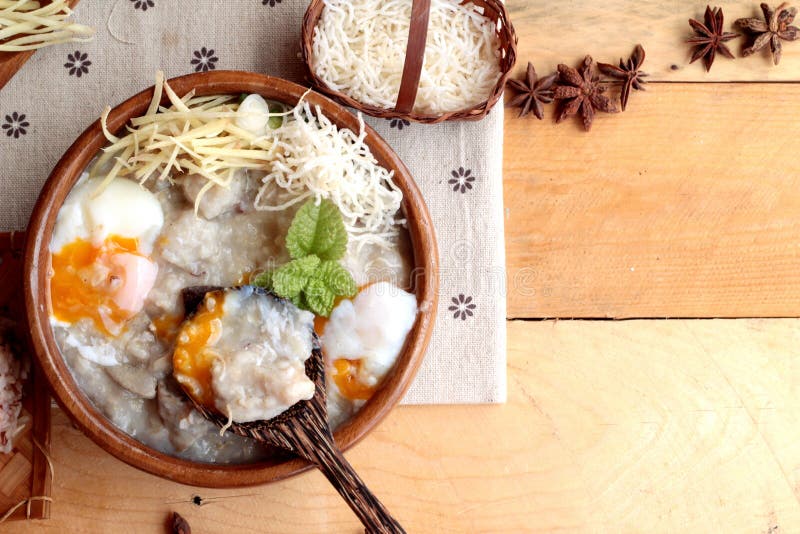 Brown Rice Porridge Put Pork and Soft-boiled Egg of Delicious. Stock ...