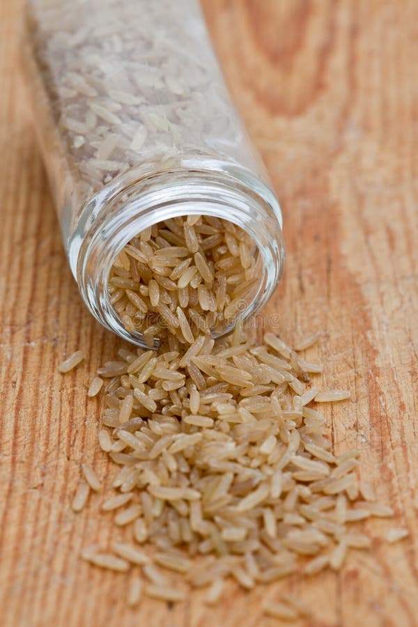 Brown Rice in a Small Glass Jar Stock Photo - Image of glass, cutting ...