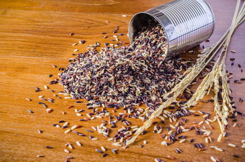 Brown Rice from Tin Can on Wooden Board Stock Image - Image of grain ...