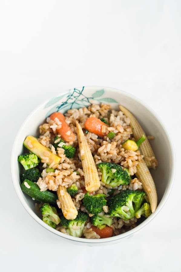 Brown rice with vegetables stock image. Image of meal - 13449929