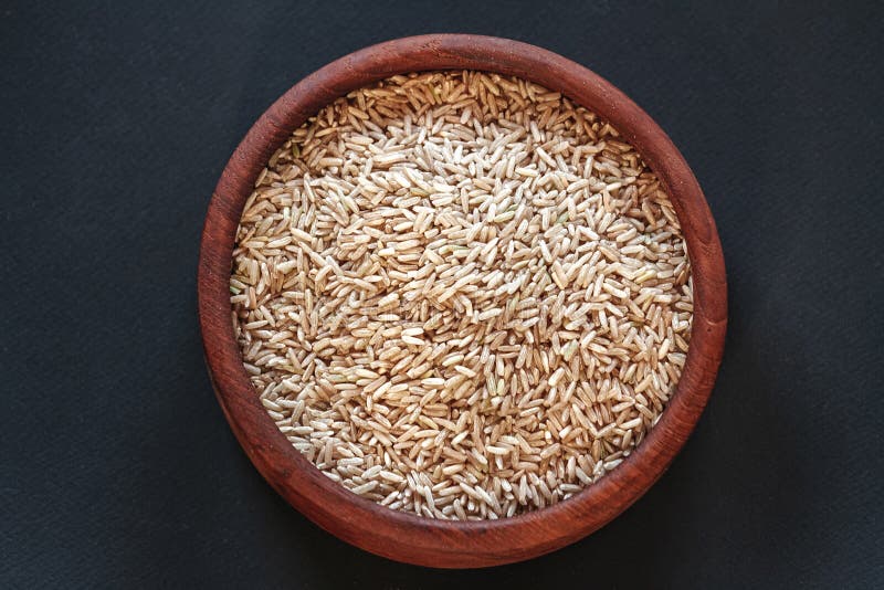 Brown Rice in Wooden Bowl Top View Stock Photo - Image of rice ...