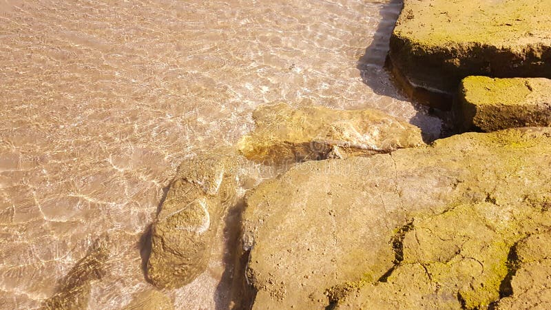 Brown Rocks with Beautiful Clearly Water Waves Stock Image - Image of ...