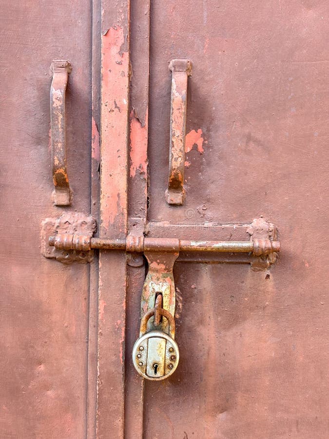 A Brown Rusted Closed Door with a Lock Closeup Stock Photo - Image of ...