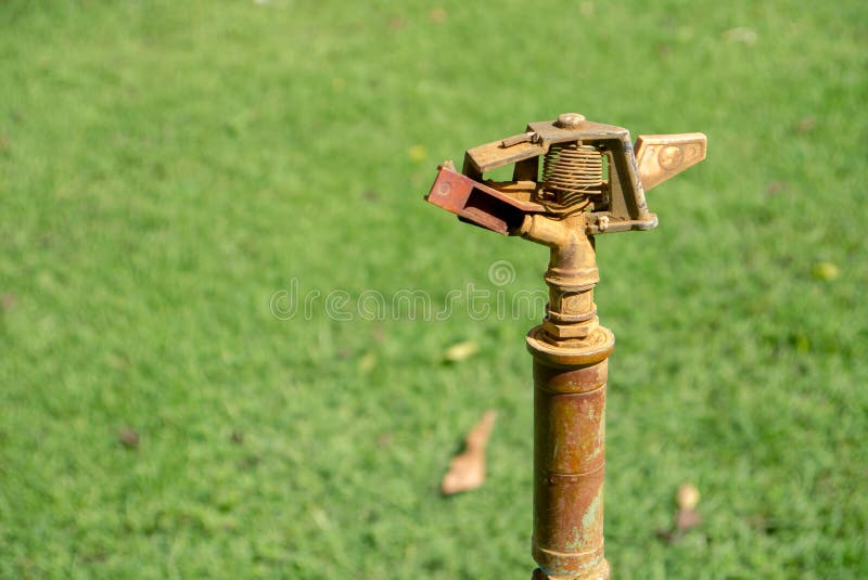 Brown rusty sprinkler stock image. Image of irrigate - 69214517