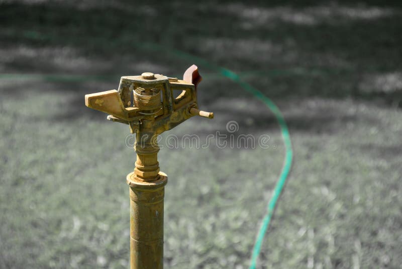 Brown rusty sprinkler stock photo. Image of summer, grass - 69214528