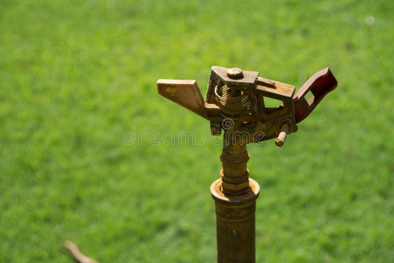 Brown rusty sprinkler stock image. Image of garden, yard - 69214535
