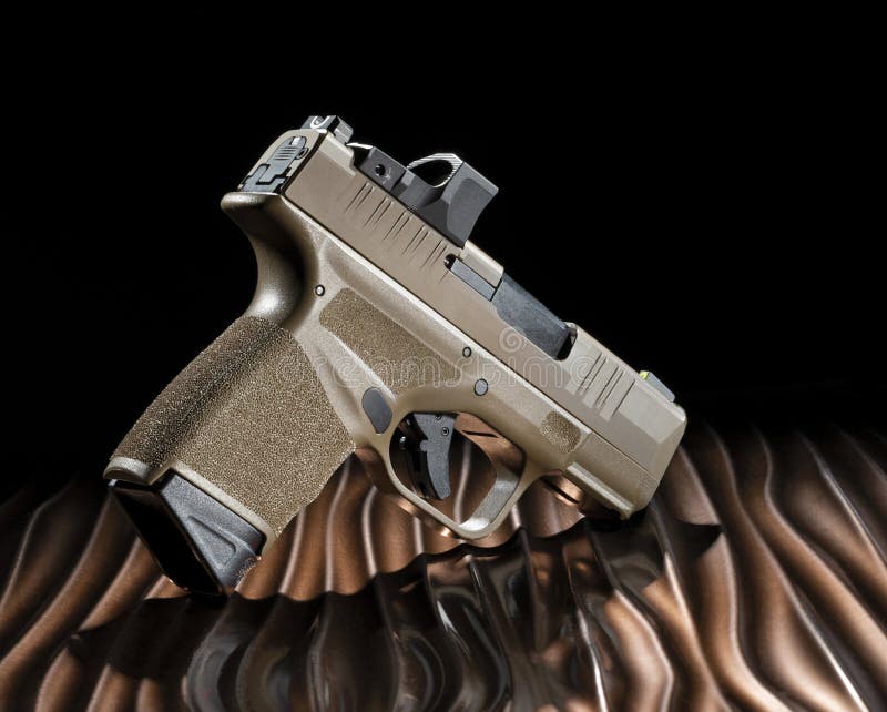 Tan Semi-auto Pistol on a Wavy Surface Stock Photo - Image of violence ...
