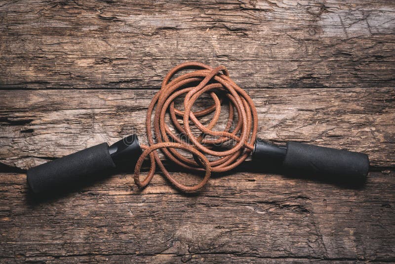 A brown skipping rope stock photo. Image of floor, table - 220500300
