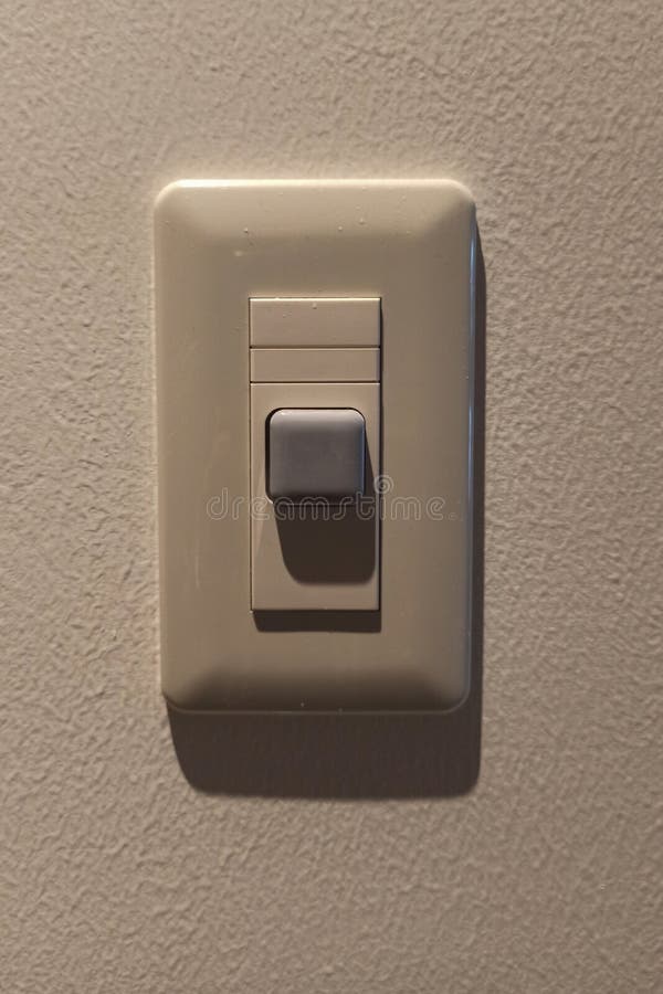 A Brown Square Light Switch is Attached To the Wall Stock Image - Image ...
