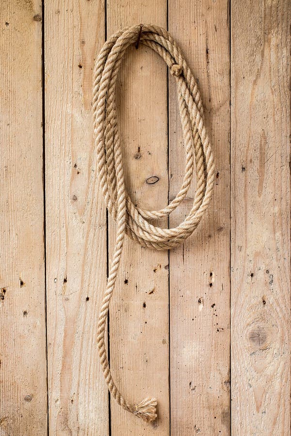 Brown String Hanging on Wooden Wall Stock Image - Image of loop, rough ...