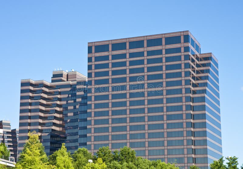 Brown Striped Glass Tiered Building on Blue Stock Image - Image of ...