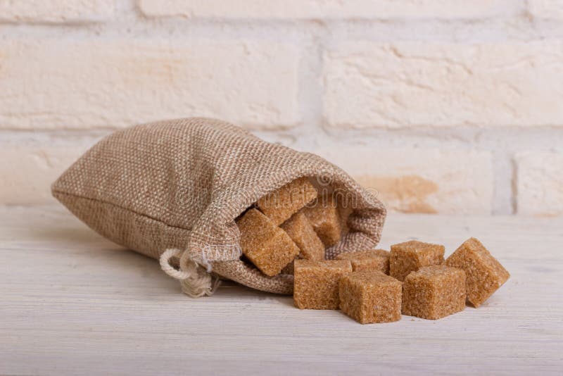 Brown sugar cubes in a bag stock photo. Image of sack - 207669018