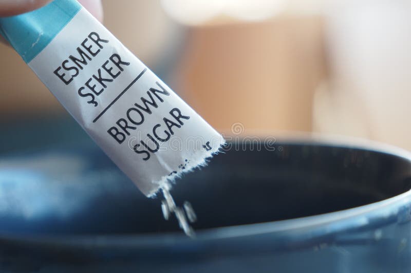 Brown Sugar in a Paper Packet Pouring Stock Image - Image of sugar ...