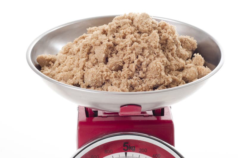 Brown sugar on scale stock photo. Image of white, balance - 13991098