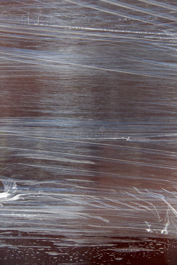 Brown Surface Covered in a Thin Transparent Plastic Clinging Wrap Stock ...
