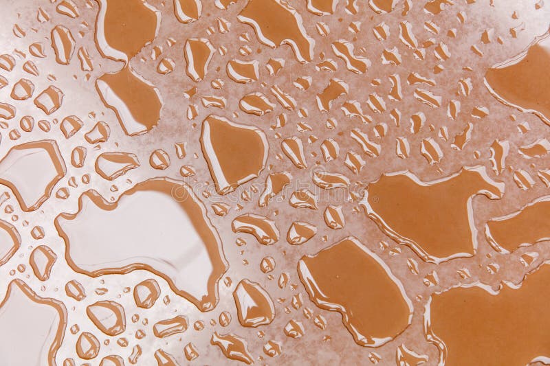 A Brown Surface with Water Droplets Scattered All Over it Stock Photo ...