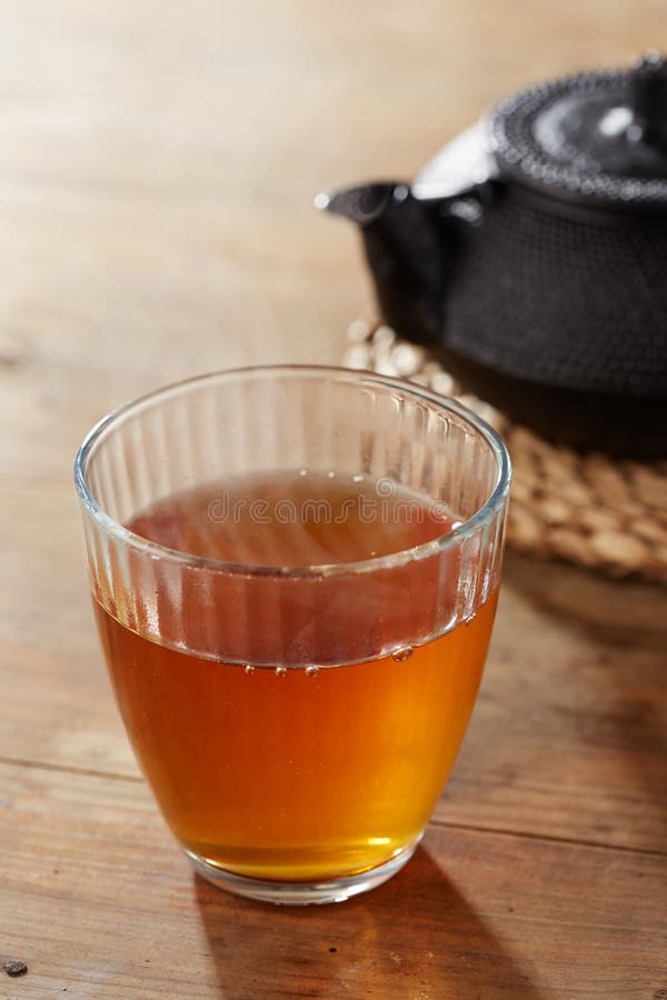 Brown tea on glass cup stock photo. Image of stem, herb - 35091096