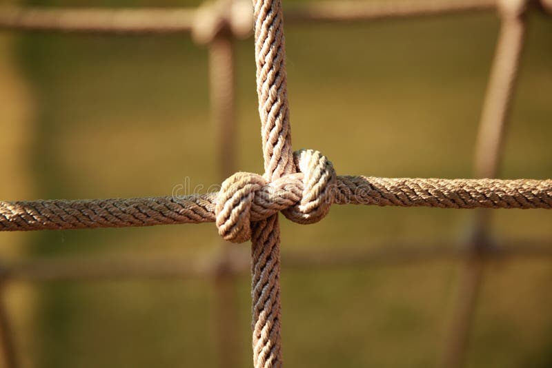 Brown Twisted Rope of Climbing Net in the Playground. Rope Knot Stock ...