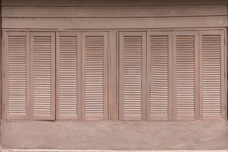 Brown Wall of Old Style Windows Closed in Pattern Stock Image - Image ...