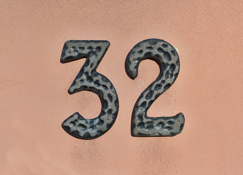 A Brown Wall, Showing the Number Thirty Two Stock Image - Image of ...