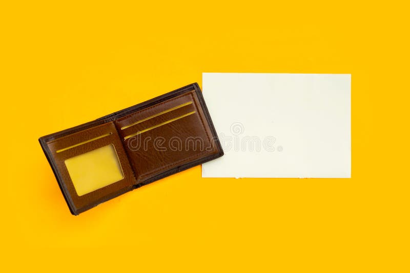 Brown Wallet with White Paper on Yellow Stock Photo - Image of metal ...