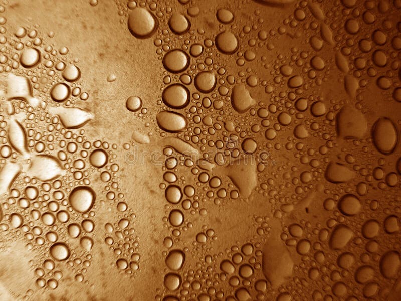 Golden Amber Water Drops stock image. Image of drink, shape - 4683827