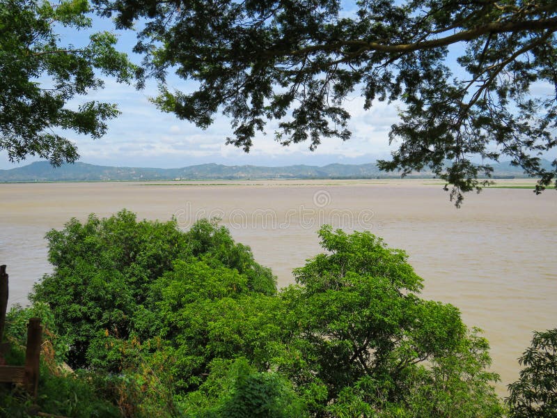 The Brown Waters of the Irrawaddy River Seen through Trees in Myanmar ...