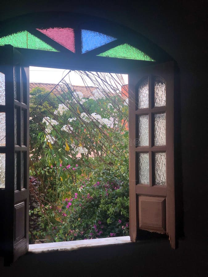 Brown Window with Tinted Glass Overlooking Another Window Stock Photo ...