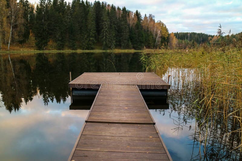 Wooden dock on autumn lake stock image. Image of forest - 10262771
