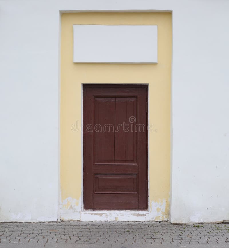 Brown Wooden False Door in a Yellow-white Wall Stock Photo - Image of ...