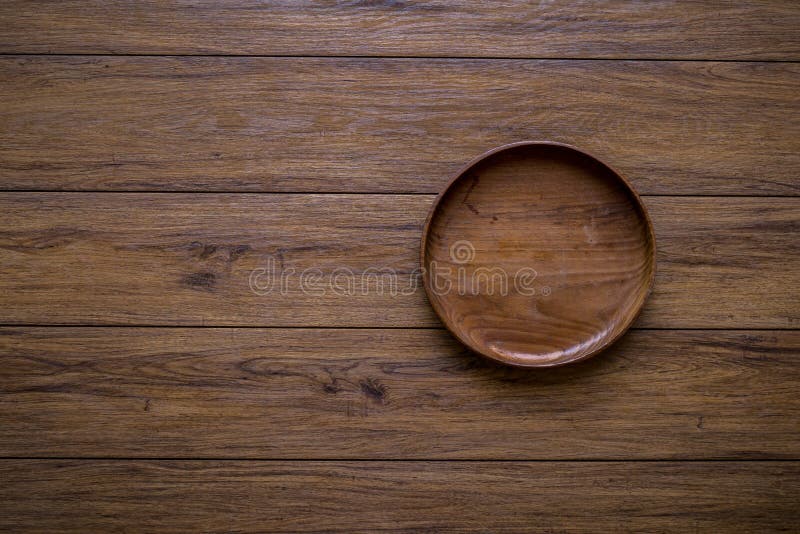 The Brown Wooden Plate on a Rustic Table Closeup. Horizontal Top Stock ...