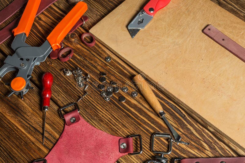 On Brown Wooden Table Scattered with Tools and Accessories for Working ...