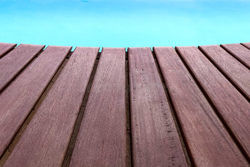 Wooden Tables and Wide Swimming Pool Stock Image - Image of plank ...
