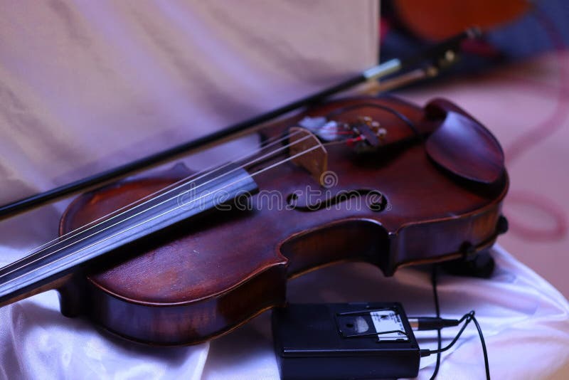 Brown Wooden Violin, a Classical Musical Instrument Placed on the Table ...