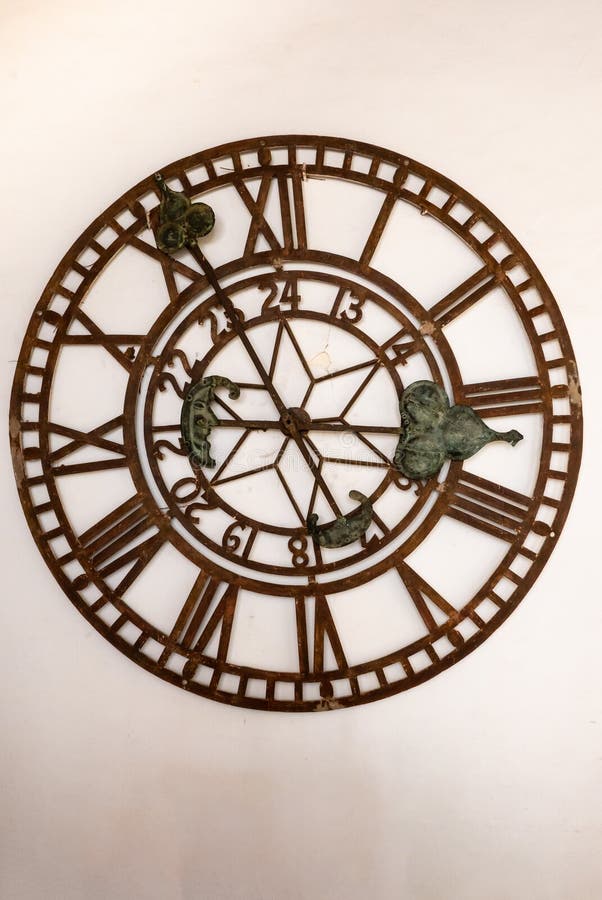 Brown Wrought Iron Wall Clock Stock Image - Image of design, fashioned ...