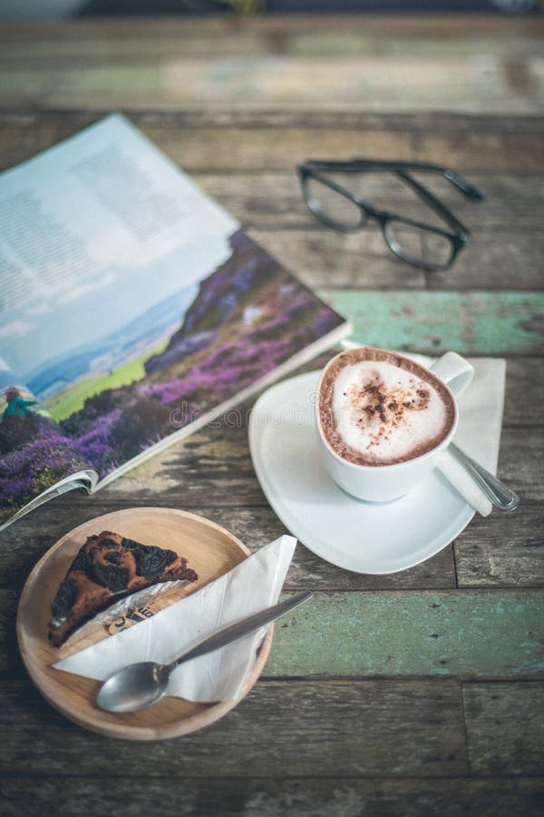 Brownie Cake, Hot Coffee and Magazine Stock Photo - Image of close ...