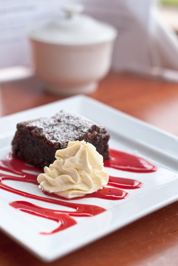Brownie with Raspberry Coulis Stock Image - Image of spoon, souffle ...
