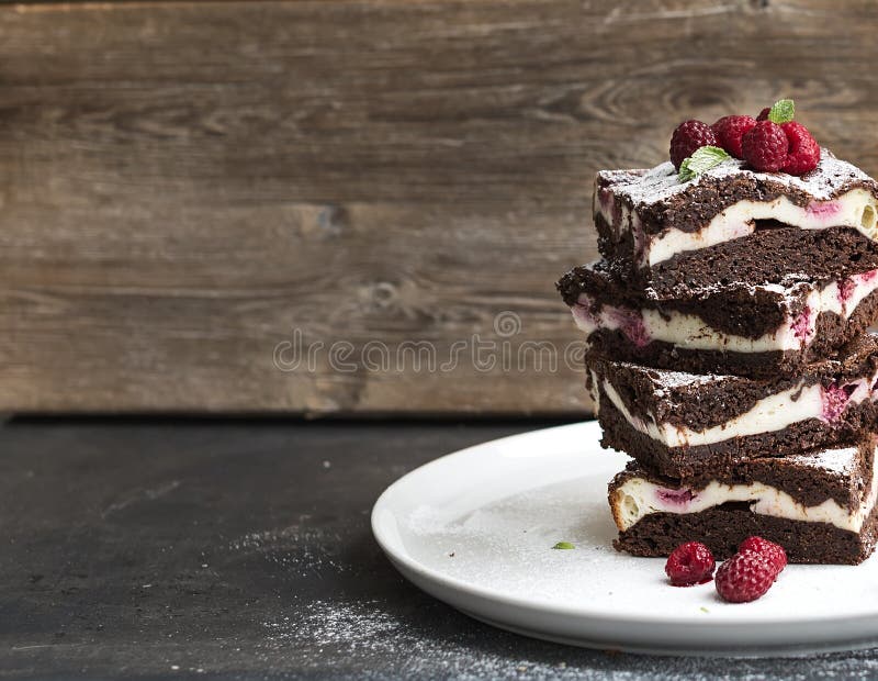 Brownies-cheesecake Tower with Raspberries on Stock Photo - Image of ...