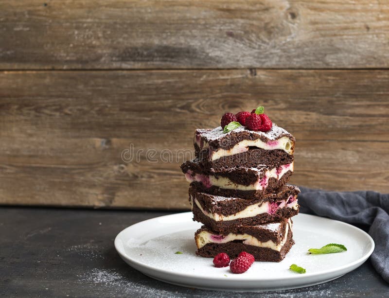 Brownies-cheesecake Tower with Raspberries on Stock Photo - Image of ...