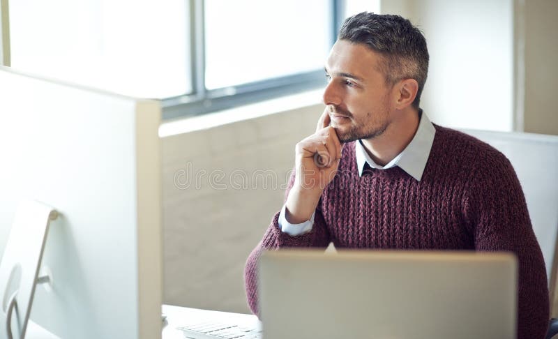 Browsing for Information on His Project Online. a Businessman Working ...