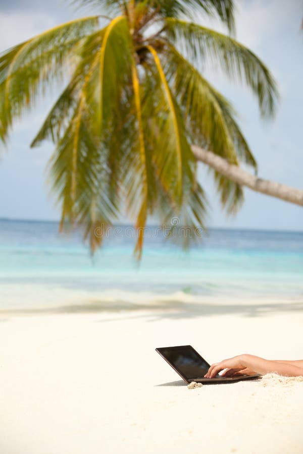 The laptop on a beach stock photo. Image of lagoon, holiday - 21510506