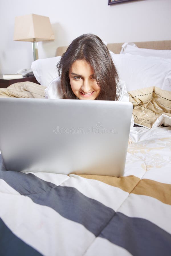 Browsing internet on bed stock photo. Image of technology - 28671730