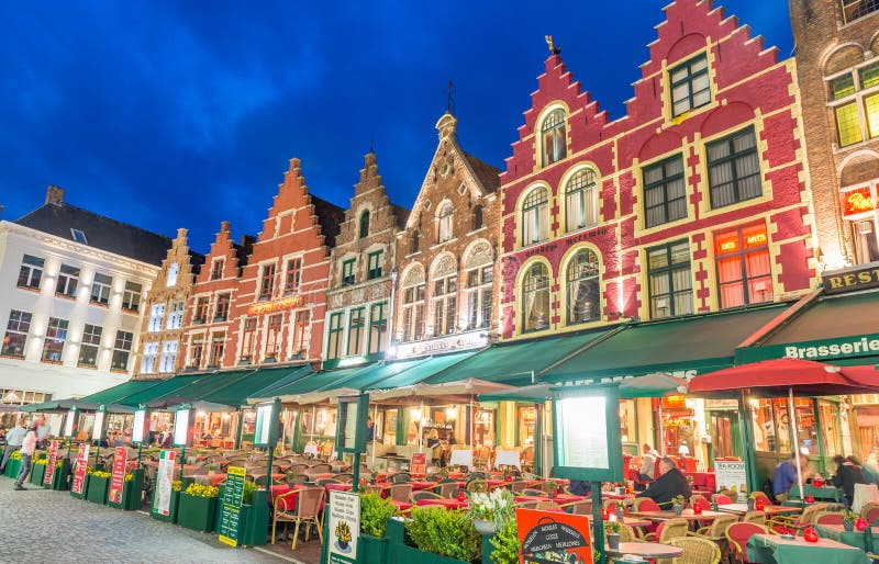 BRUGES, BELGIUM - MARCH 2015: Tourists Visit Ancient Medieval Ci ... BRUGES, BELGIUM - MARCH 2015: Tourists Visit Ancient Medieval Ci ...