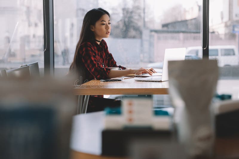 Brunette Asian Girl Using Laptop Computer in Cafe Stock Photo - Image ...