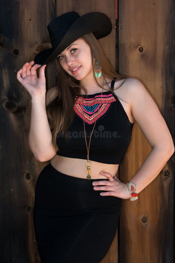 Brunette in black stock image. Image of curvy, brown - 70764885